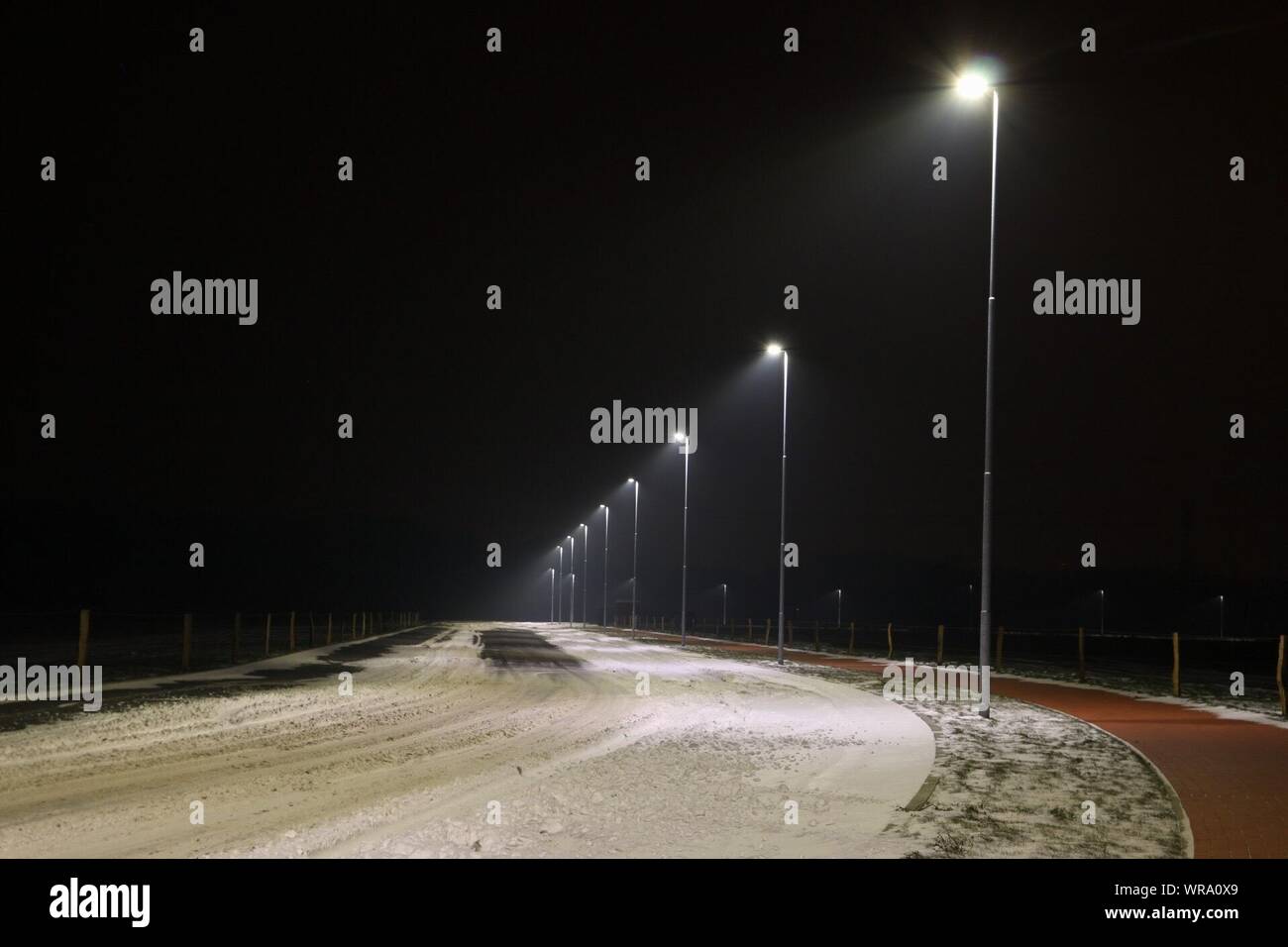 Empty winter street at night hi-res stock photography and images - Alamy