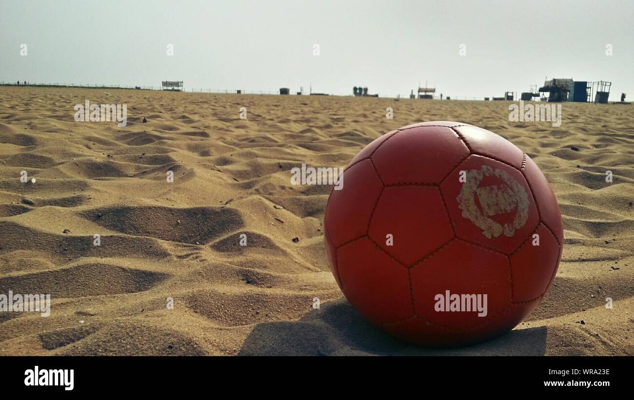 Ball on sandy beach hi-res stock photography and images - Alamy