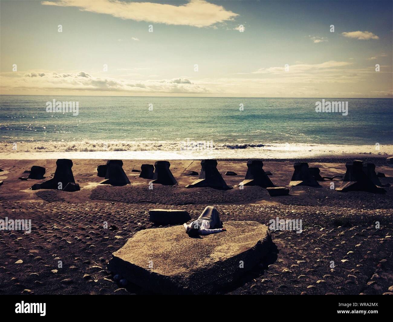 Woman sleeping on beach hi-res stock photography and images - Alamy