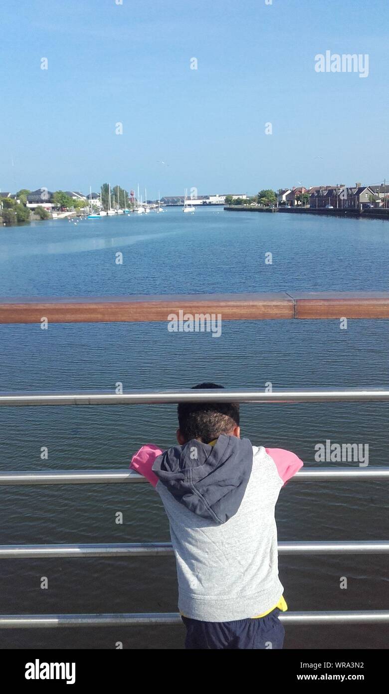 Leaning over the bridge hi-res stock photography and images - Alamy