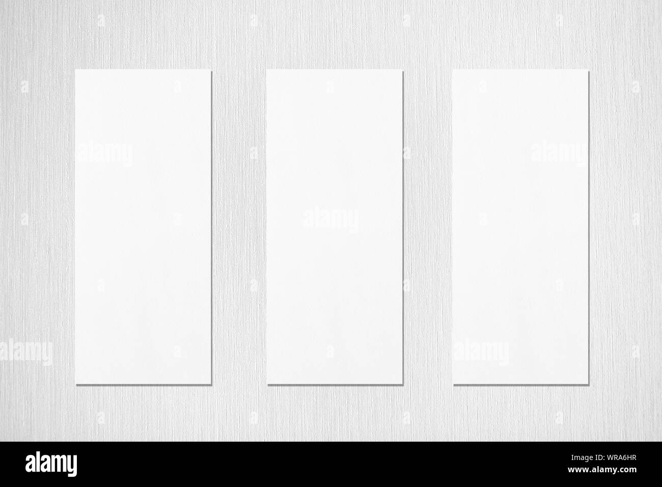 Three empty white vertical rectangle menu mockups with soft shadows on ...
