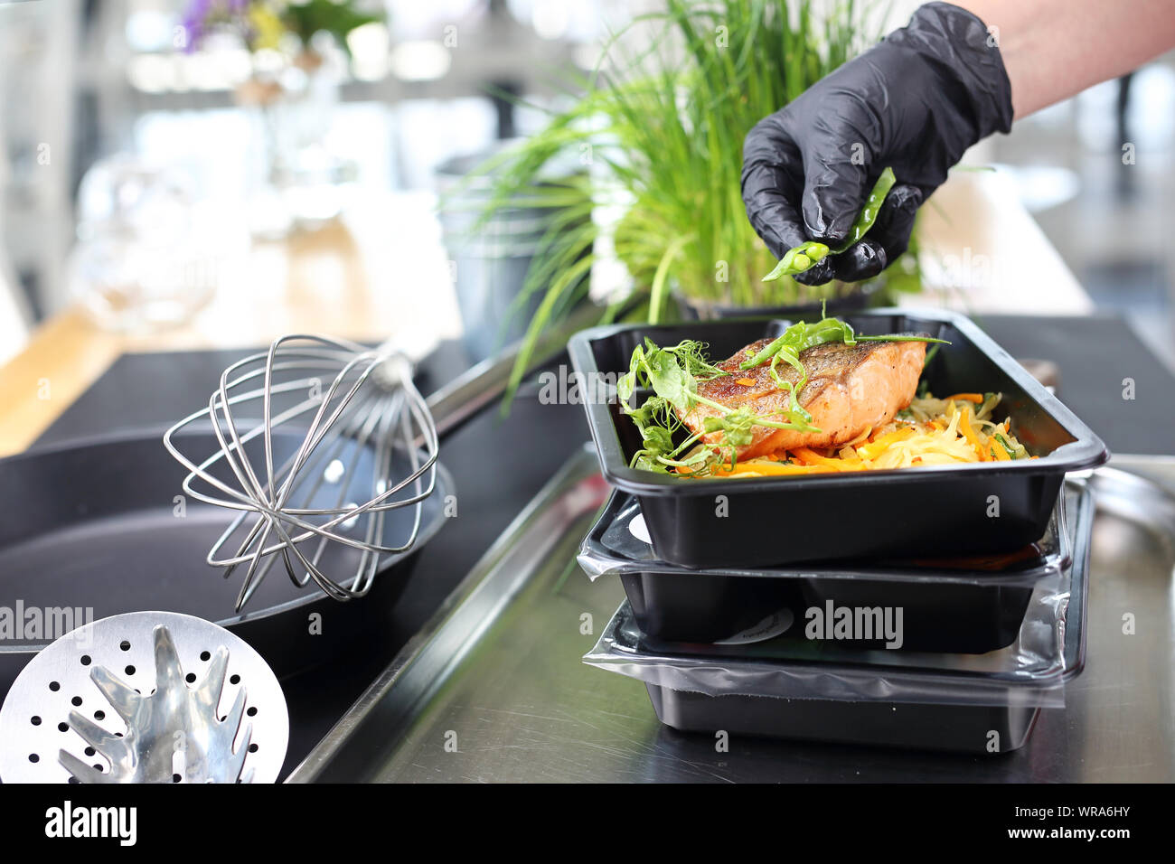 Catering. Meal prep.The cook prepares take-out dishes Stock Photo - Alamy