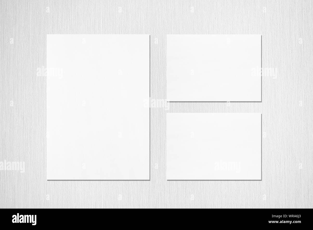 One empty white vertical a4 sized poster and two a5 sized horizontal ...