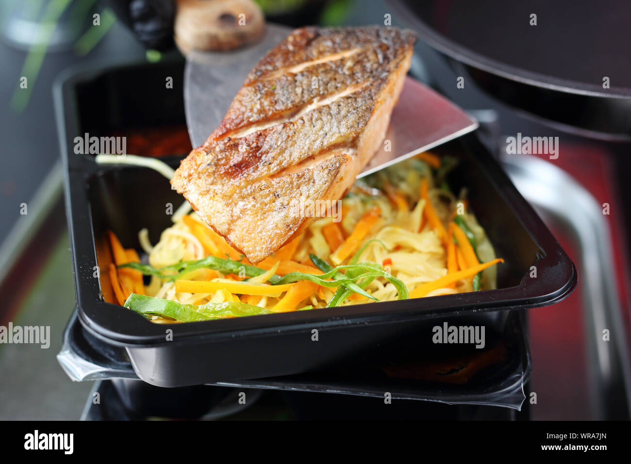 Meal prep. The cook prepares take-out dishes Stock Photo - Alamy