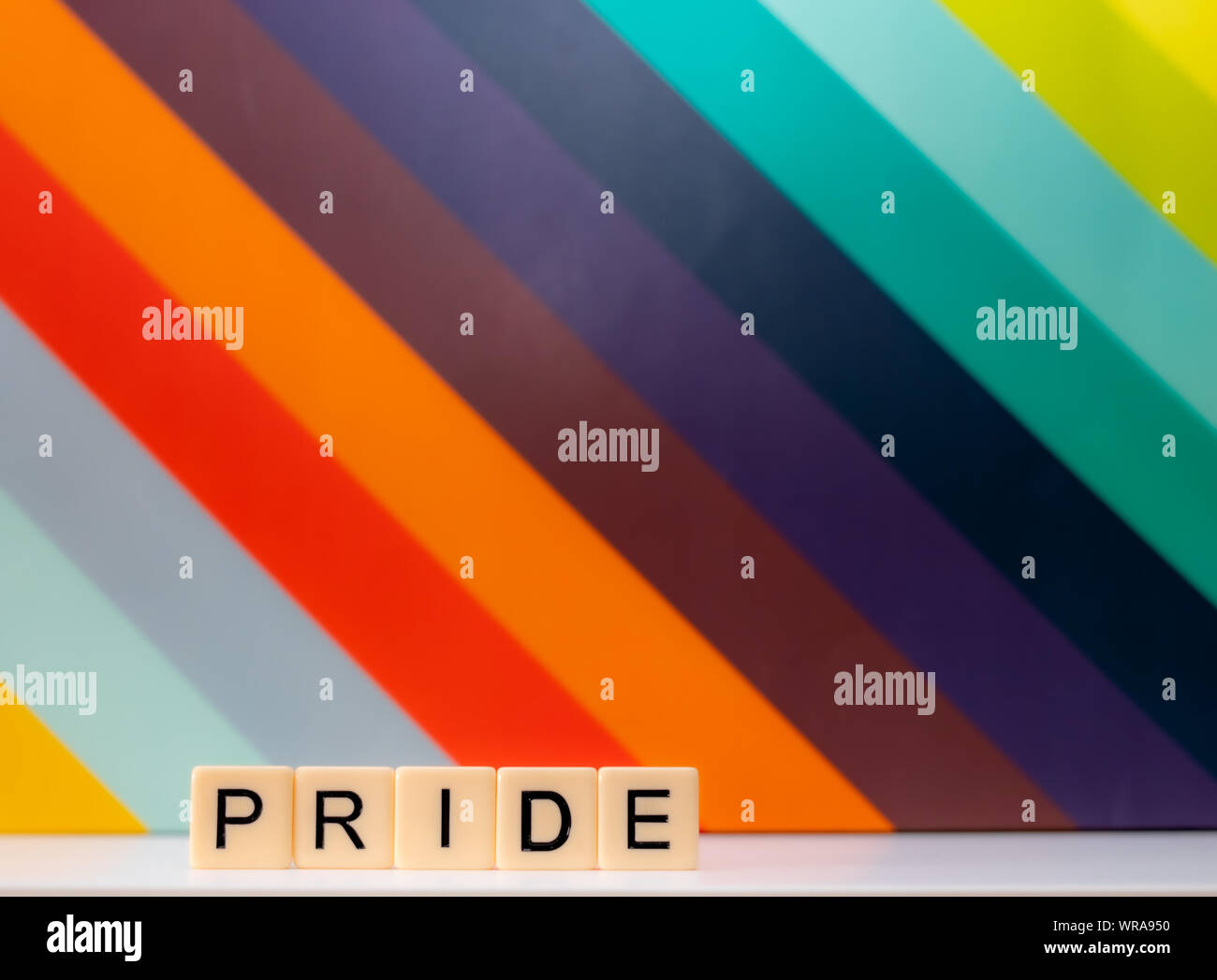 word pride against colourful backdrop Stock Photo - Alamy