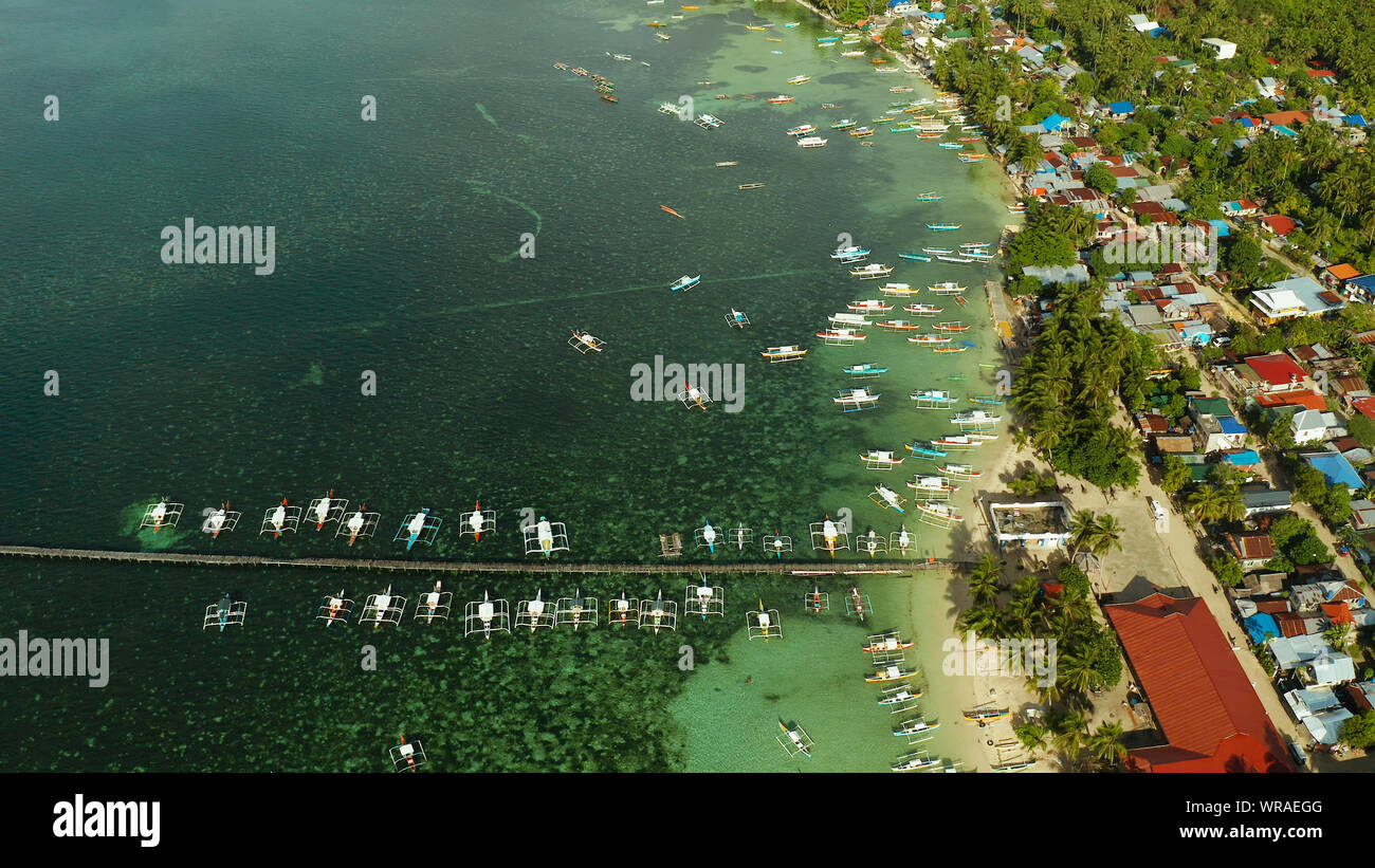 City General Luna on the coast of Siargao with a pier, a port and ...