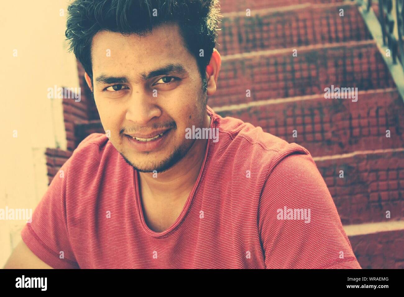 Indian man sitting on steps hi-res stock photography and images - Alamy