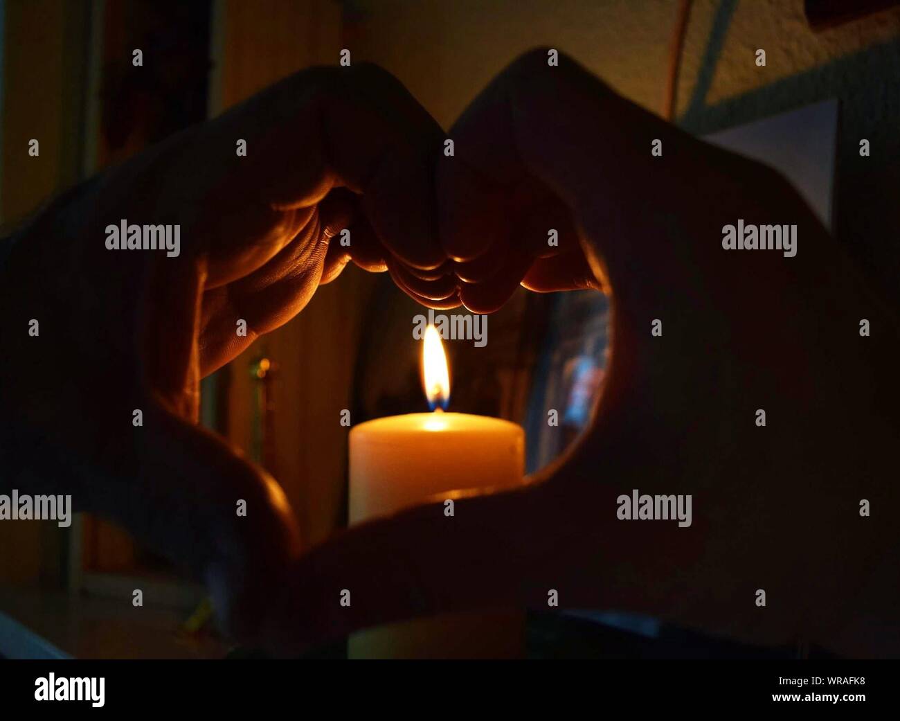 Hand holding candle home hi-res stock photography and images - Alamy