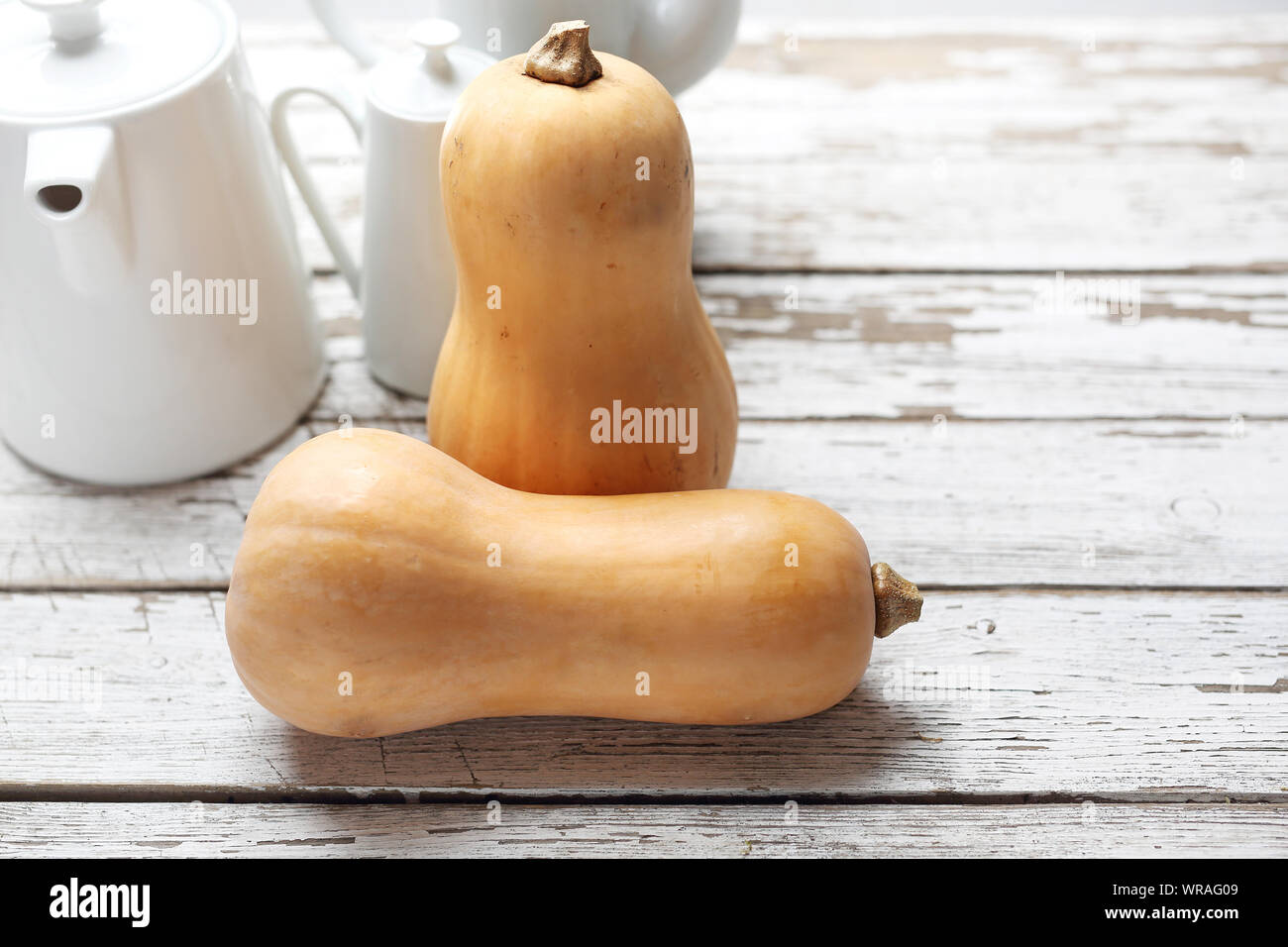 Butternut squash, fresh vegetables on a wooden countertop Stock Photo ...