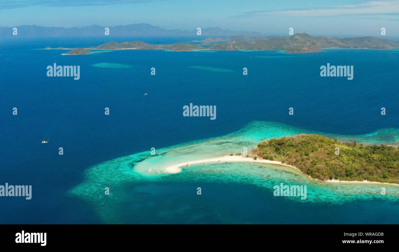 aerial seascape tropical island with sand bar, turquoise water and ...