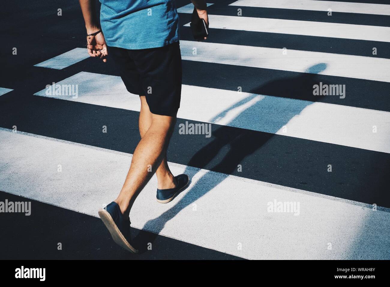 Man crossing road mobile hi-res stock photography and images - Alamy