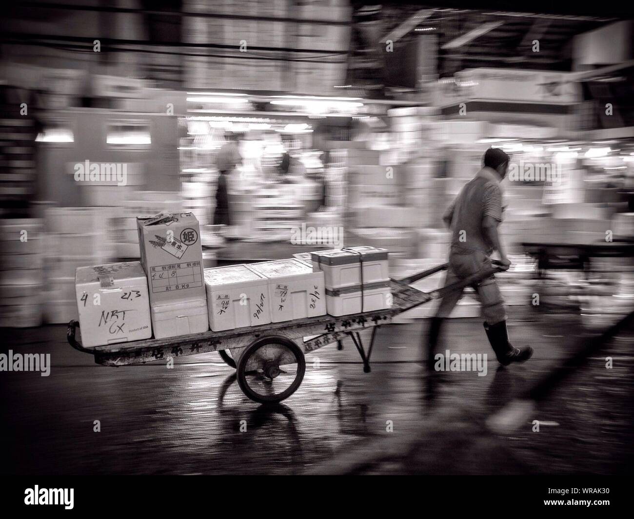 Man pulling cart hi-res stock photography and images - Alamy