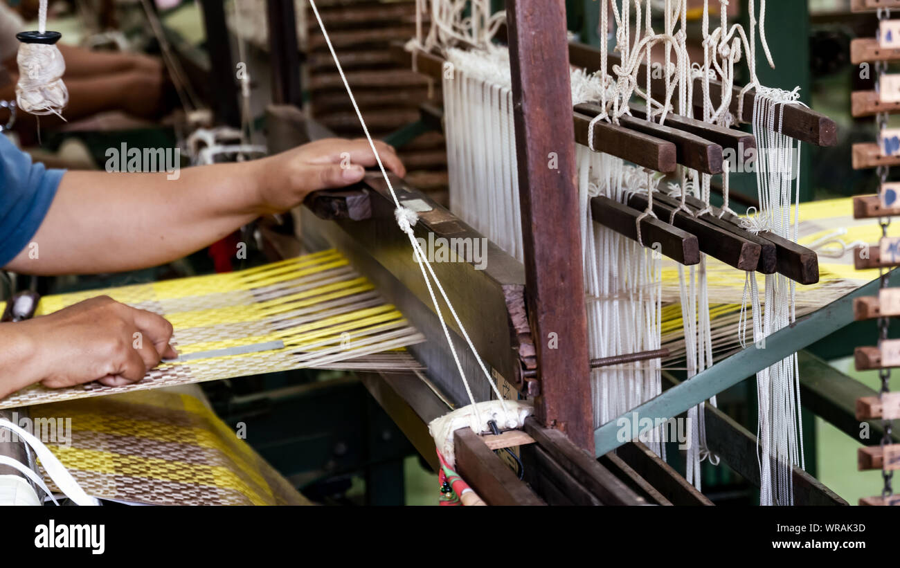weave and Thai silk. activity involving skill in making things by hand ...