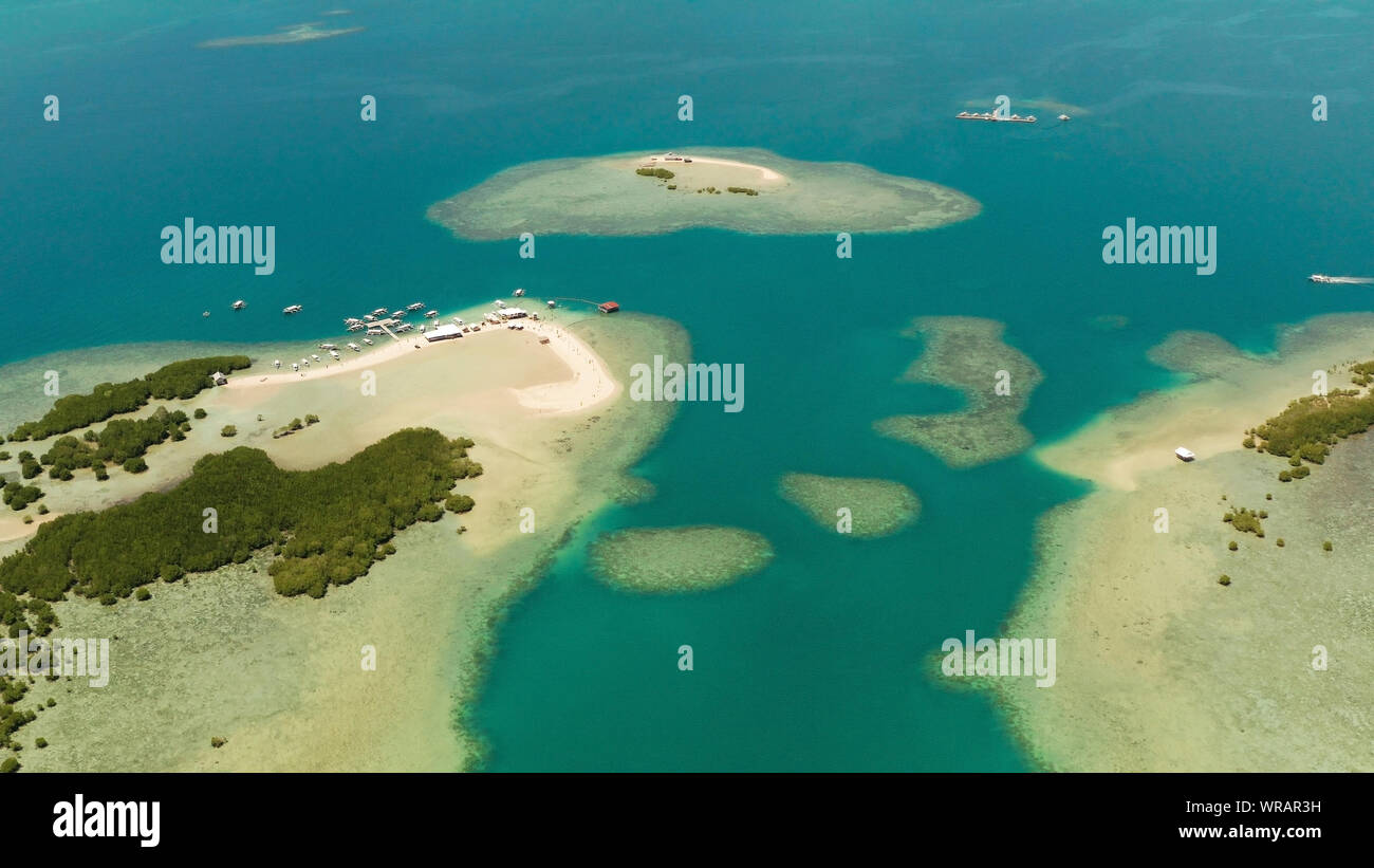 Beautiful beach on tropical island surrounded by coral reef, sandy bar ...