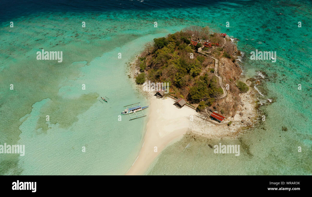 Tropical island and sand beach, turquoise water and coral reef, aerial ...