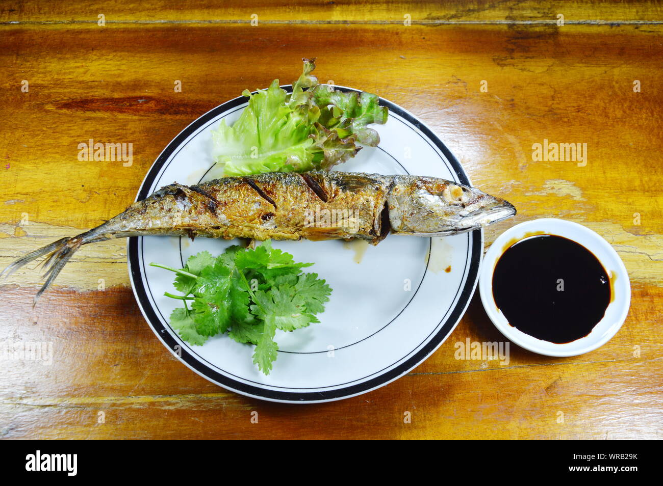 fried Saba fish and vegetable with sweet black soy sauce Stock Photo ...