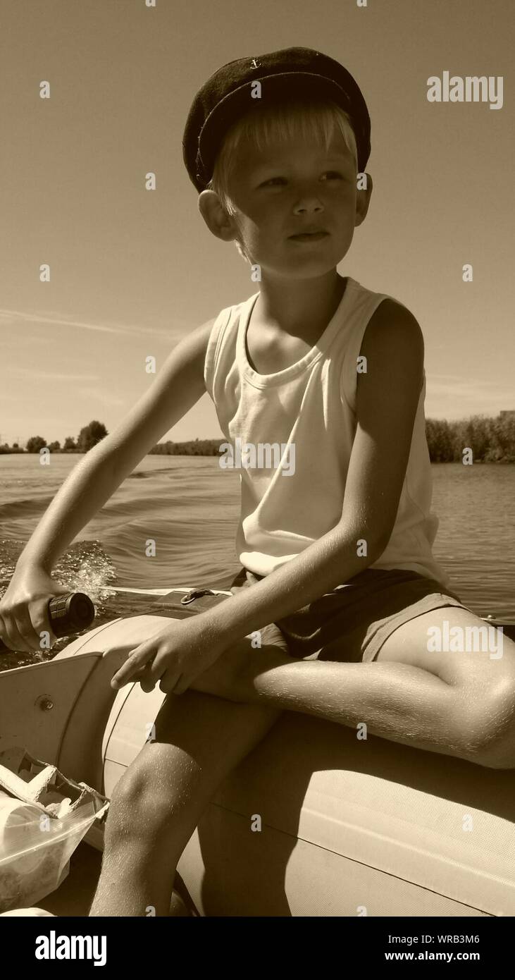 Boy On Motorboat High Resolution Stock Photography and Images - Alamy