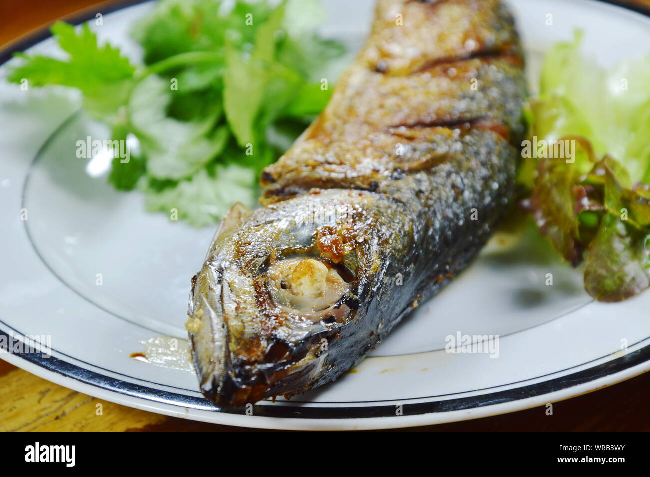 fried Saba fish and vegetable on plate Stock Photo - Alamy