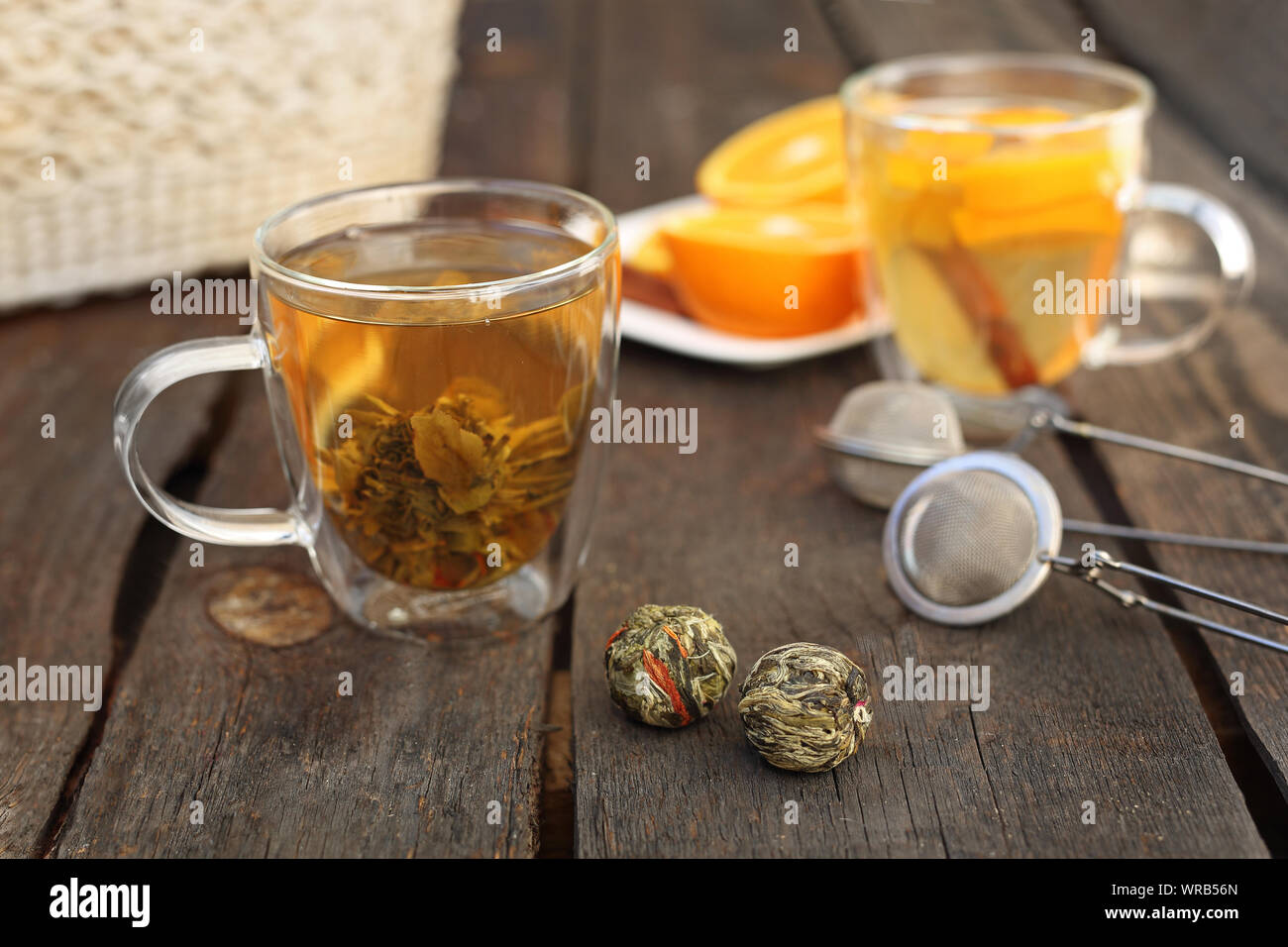 Green flowering tea. A green tea flower is brewed in a transparent ...