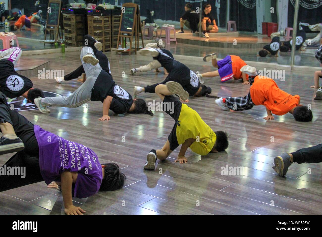 Young Chinese students practise street dancing in a training session at ...