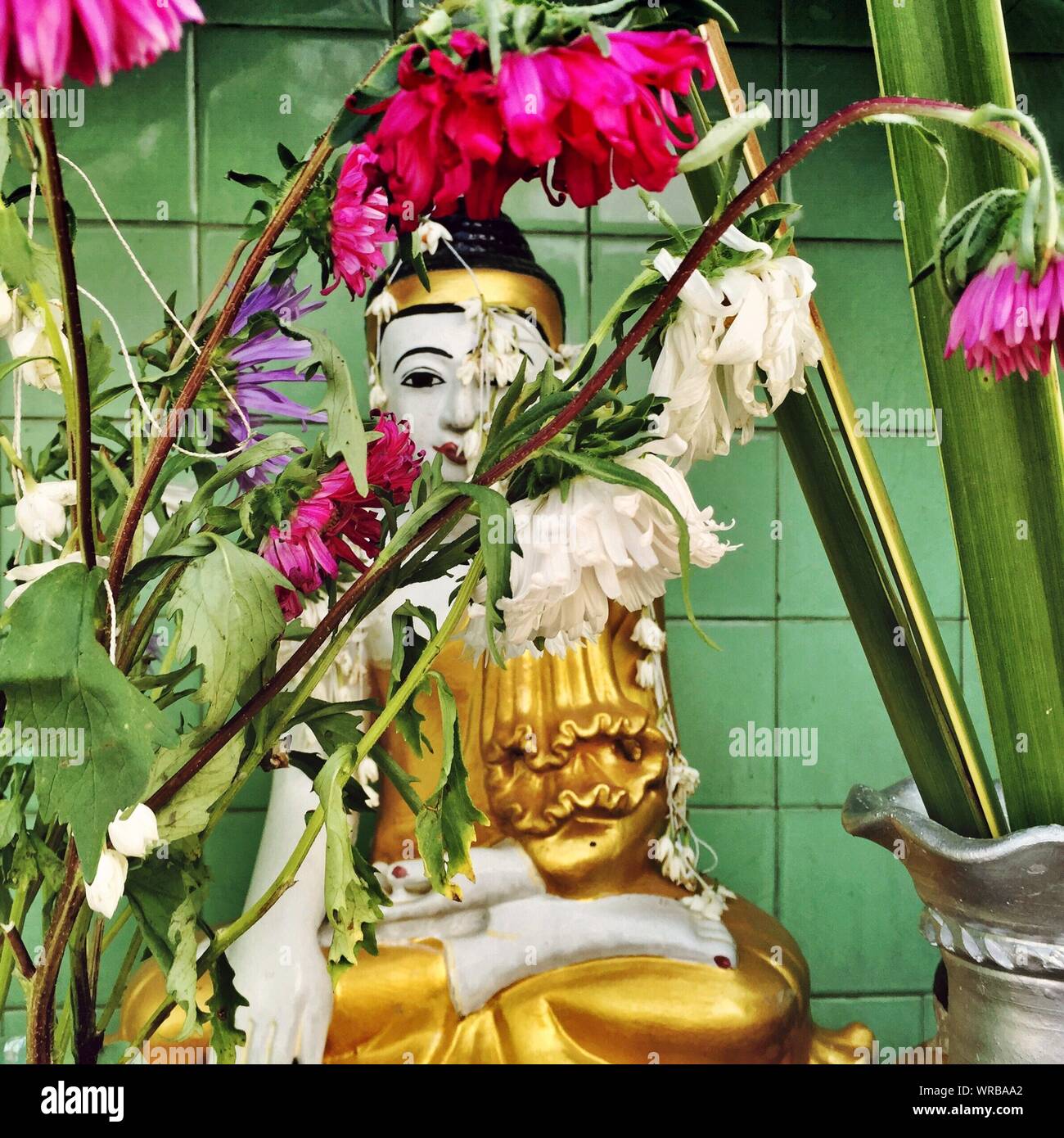 Statue Offering Flower High Resolution Stock Photography and Images - Alamy