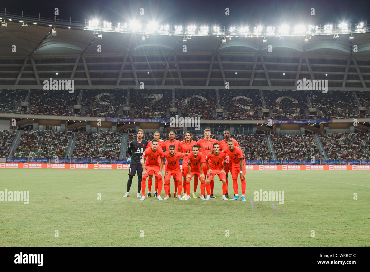 Players of the starting line-up of Paris Saint-Germain pose for photos ...