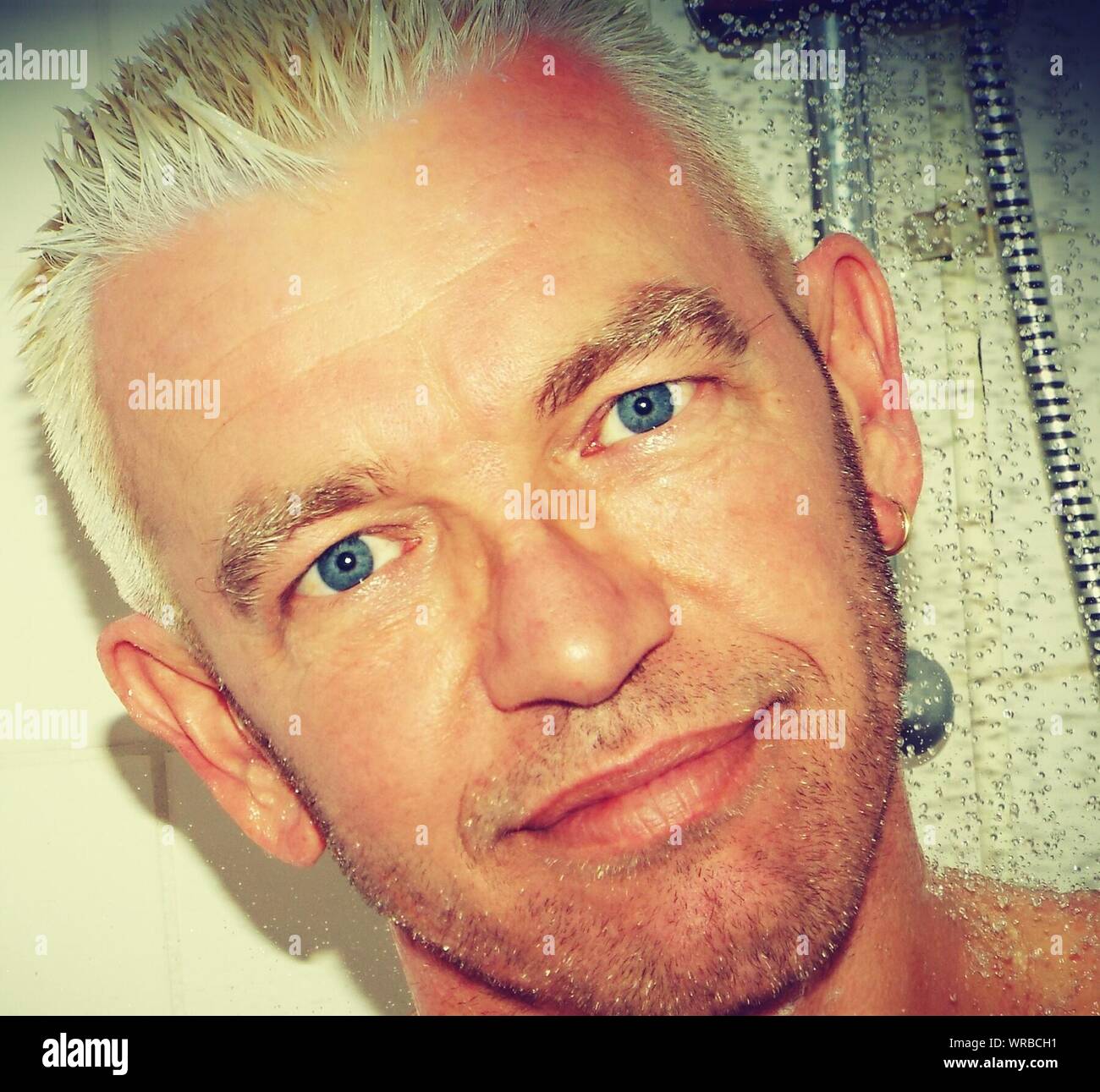Man in shower smiling bathroom hi-res stock photography and images - Alamy