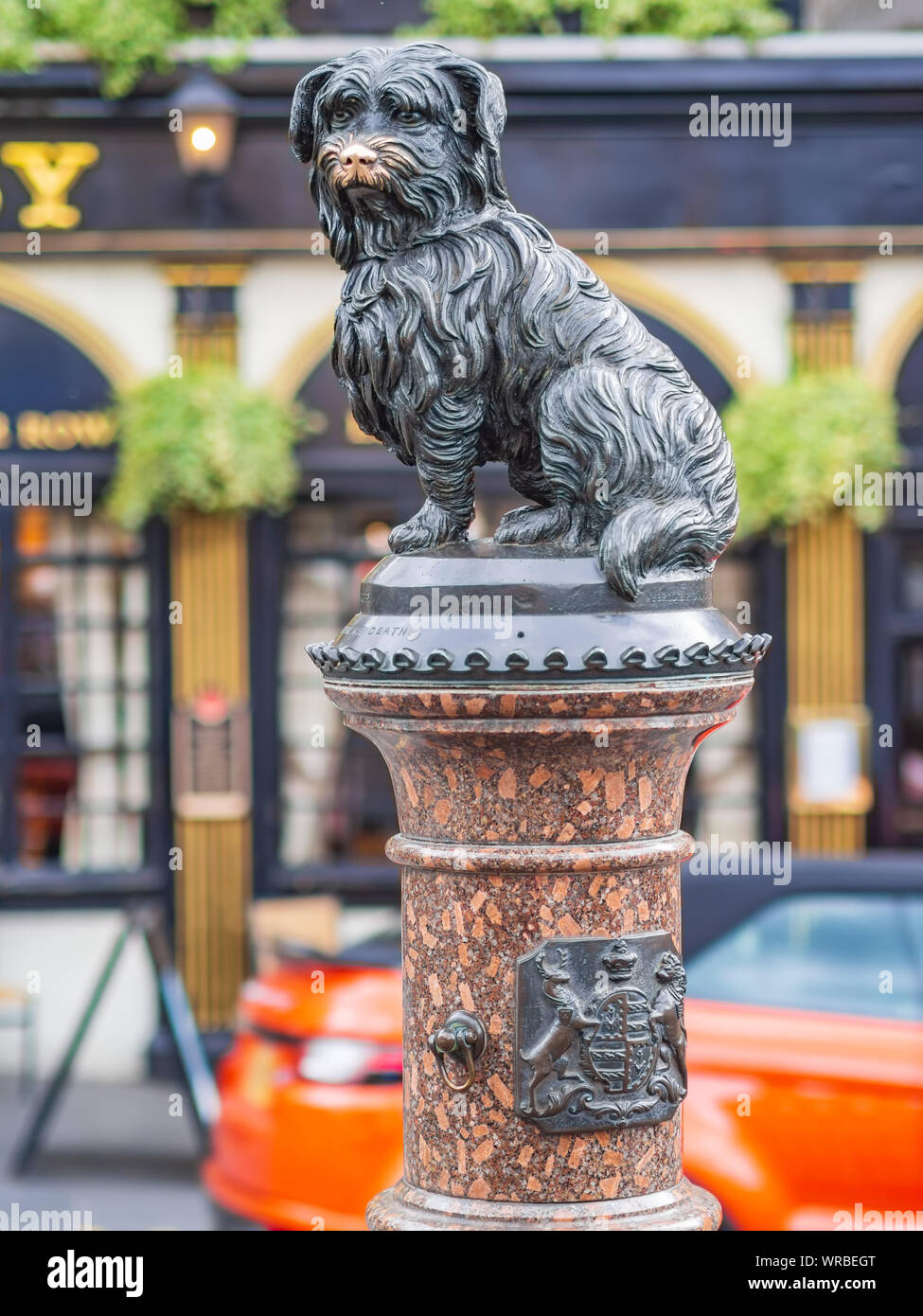 Statue of the famous loyal Skye Terrier dog Greyfriars Bobby and pub of ...