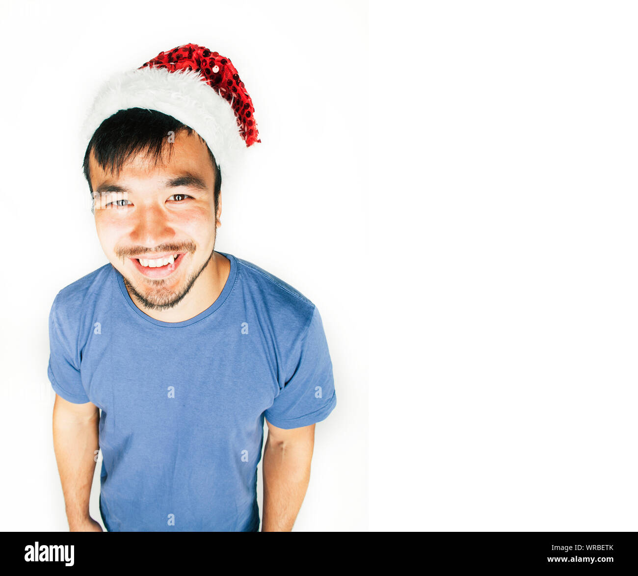 funy exotical asian Santa claus in new years red hat smiling Stock ...