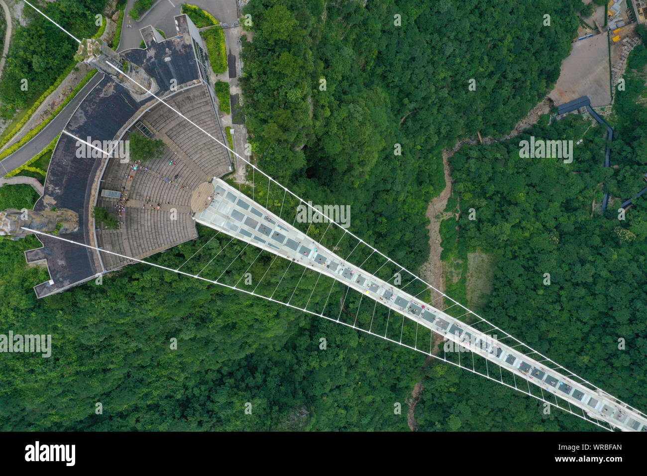 In this aerial view, tourists brave the world's longest and highest ...