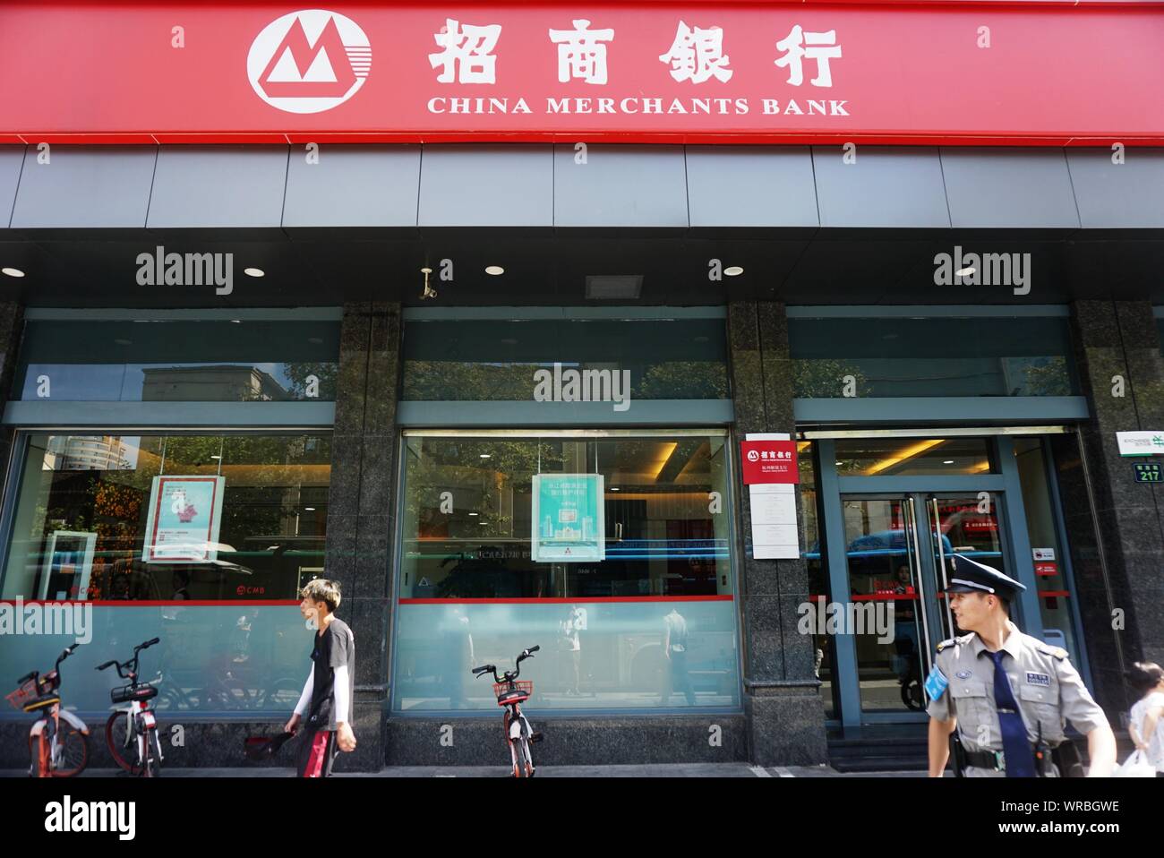 Pedestrian walking past hi-res stock photography and images - Alamy