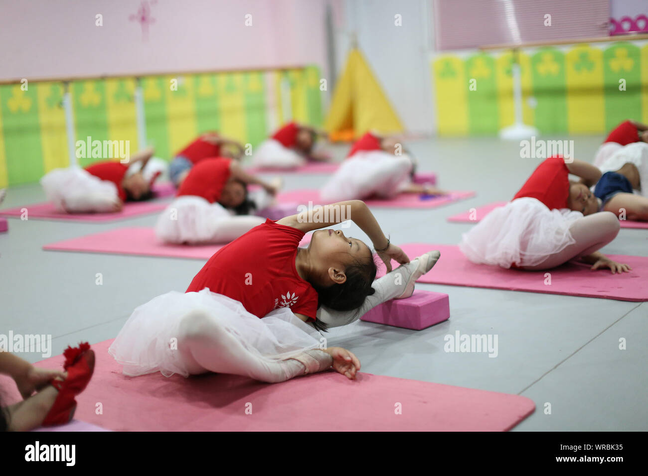 Young Chinese kids learn dancing at a school during the summer vacation ...