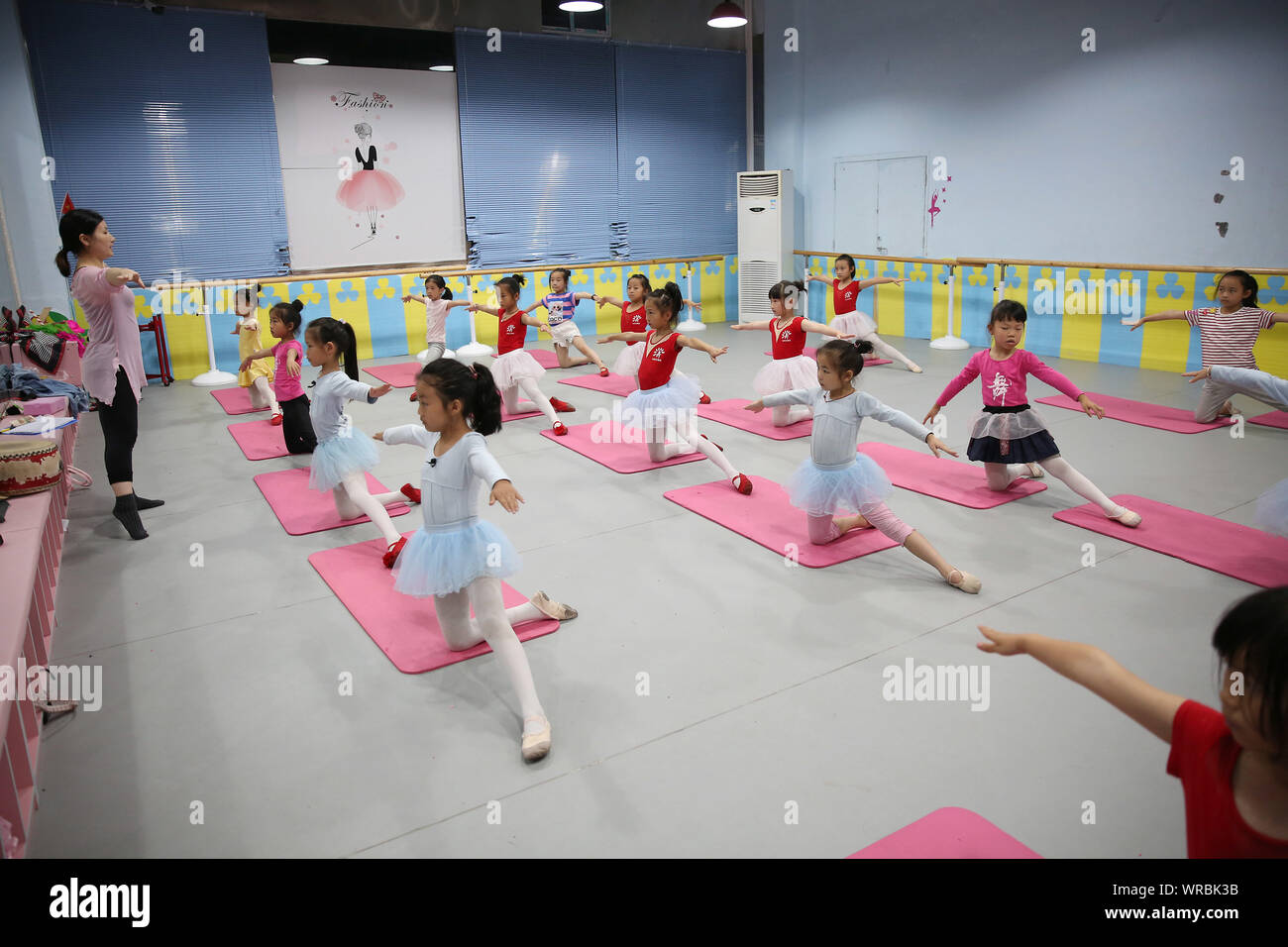 Young Chinese kids learn dancing at a school during the summer vacation ...