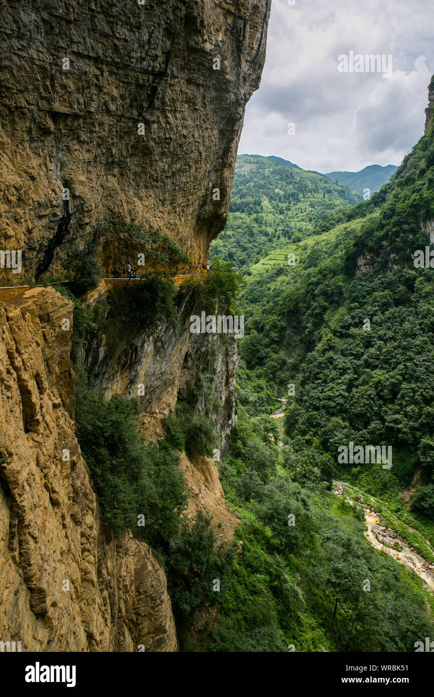 Chinese villagers maintain the Falang Canal built into the cliff in ...