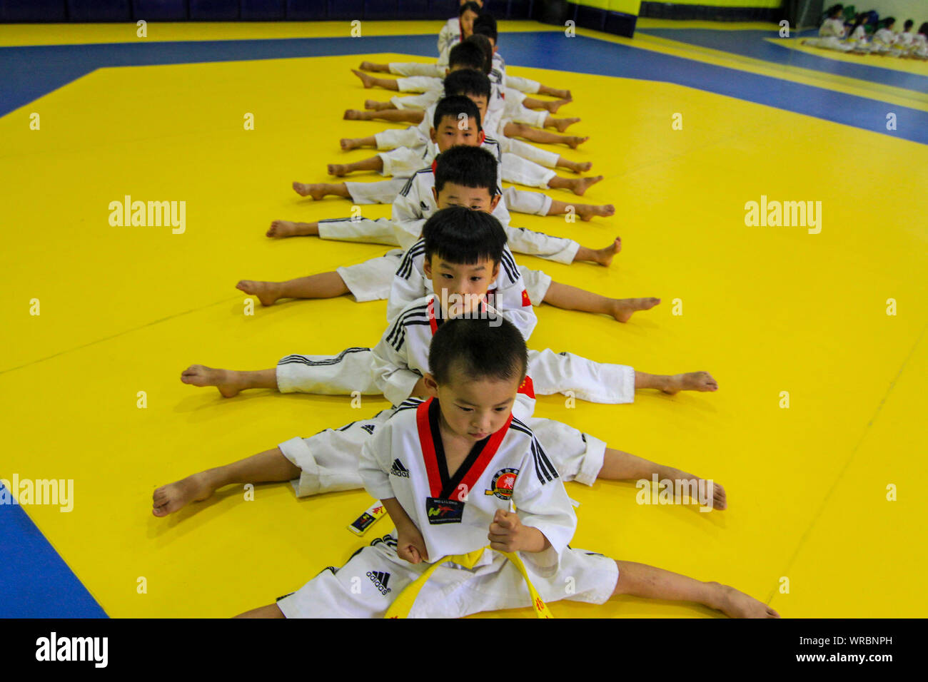 Young Chinese children practise taekwondo during a training session at ...