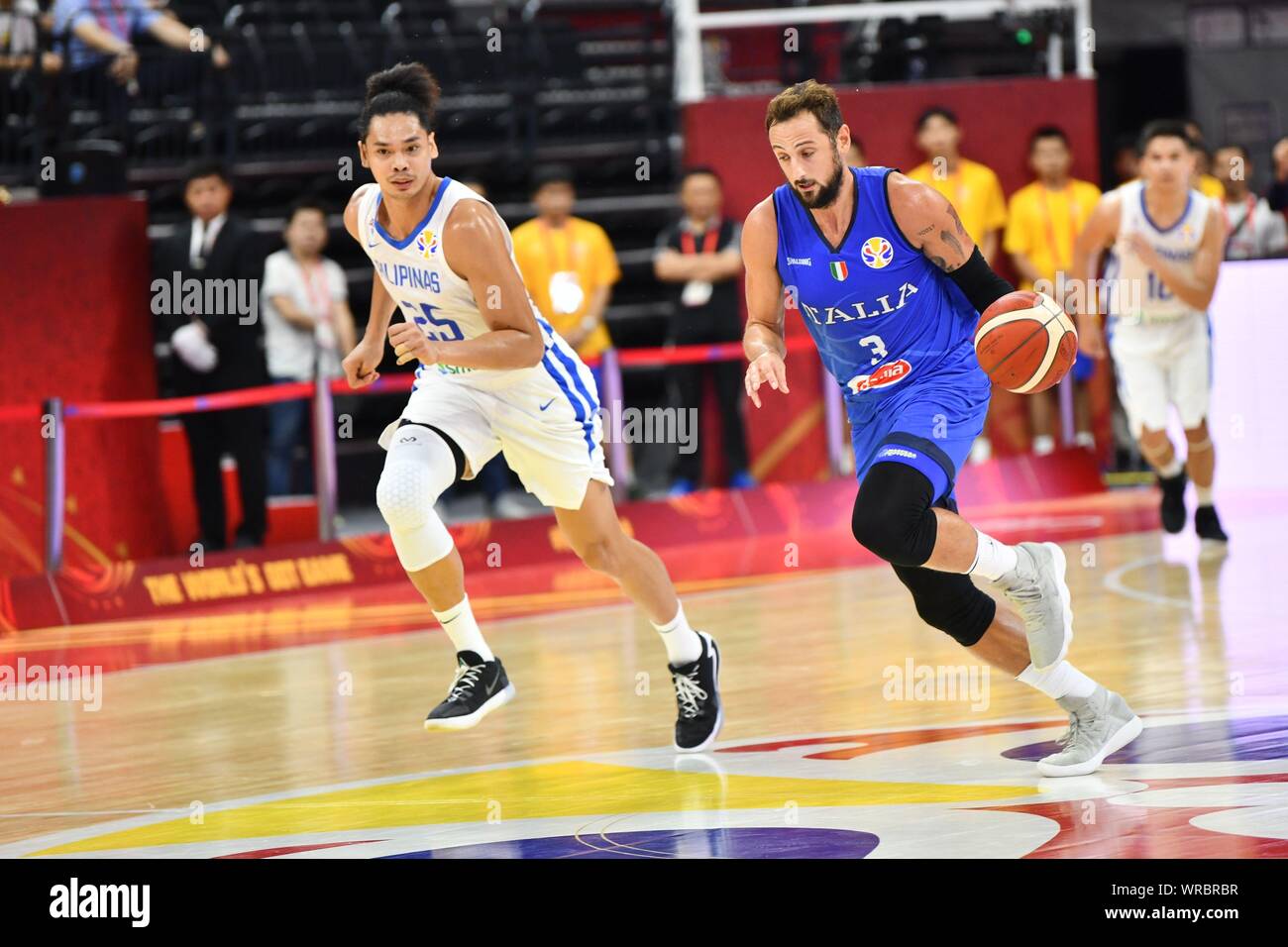Marco BELINELLI, right, of Italy dribbles next to Japeth AGUILAR of the ...