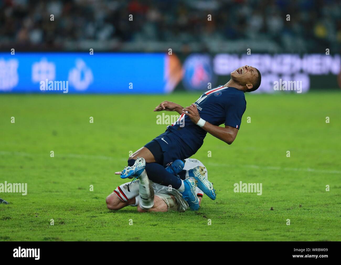 Kylian Mbappe, front, of Paris Saint-Germain reacts after being fouled ...