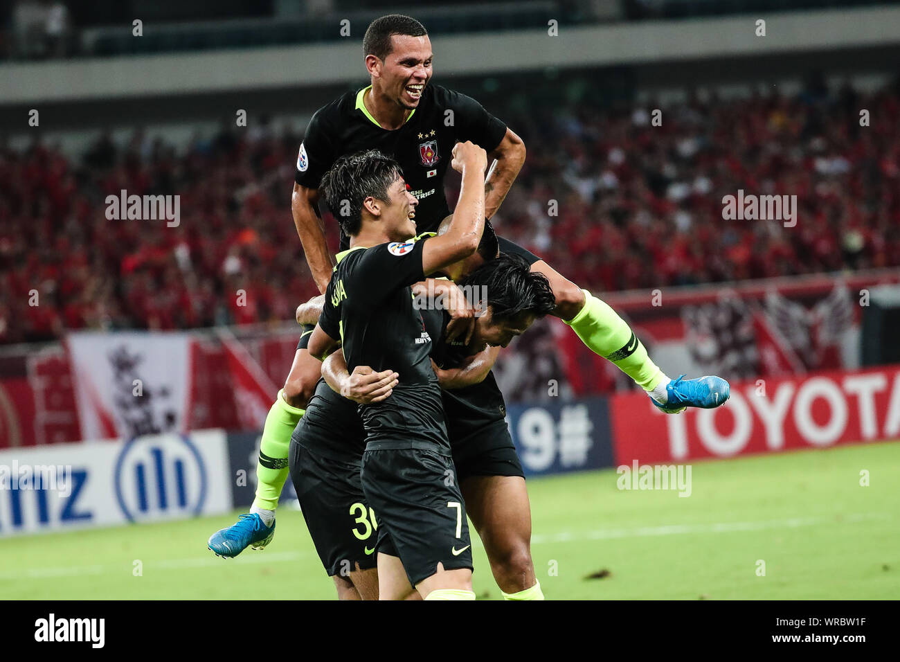 Shinzo Koroki, center, of Urawa Red Diamonds celebrates with teammates ...