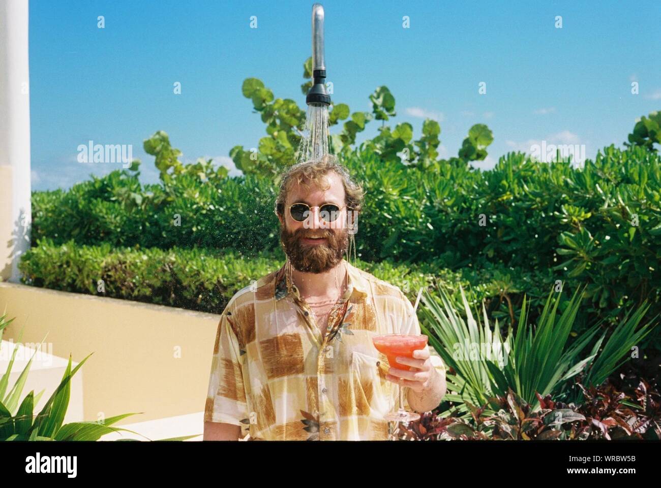 Man standing under shower hi-res stock photography and images - Alamy