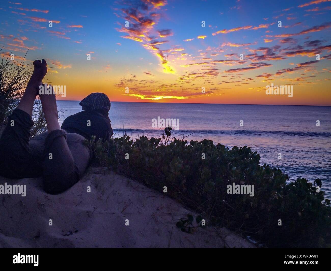 Looking down the. beach sunset beach hi-res stock photography and ...