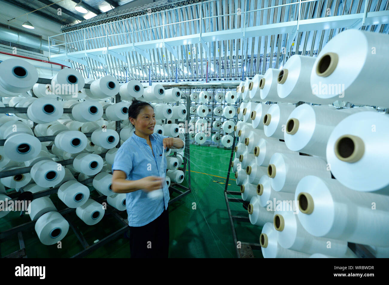 Female factory worker china hi-res stock photography and images - Alamy