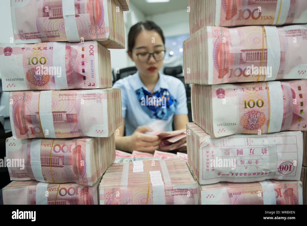 Female employee counts dollar banknotes hi-res stock photography and ...