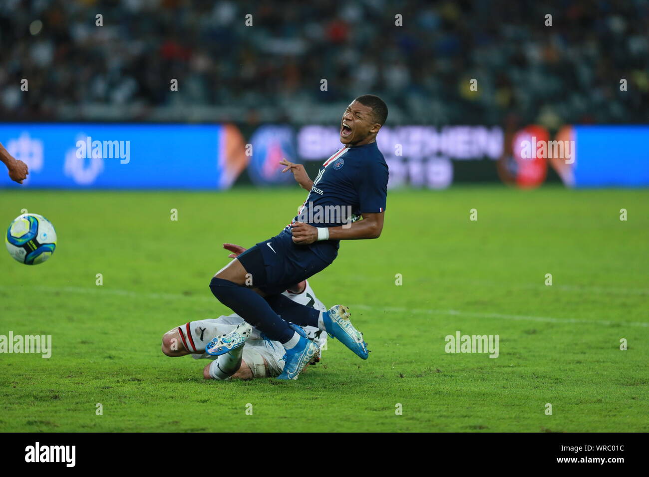 Kylian Mbappe, front, of Paris Saint-Germain reacts after being fouled ...