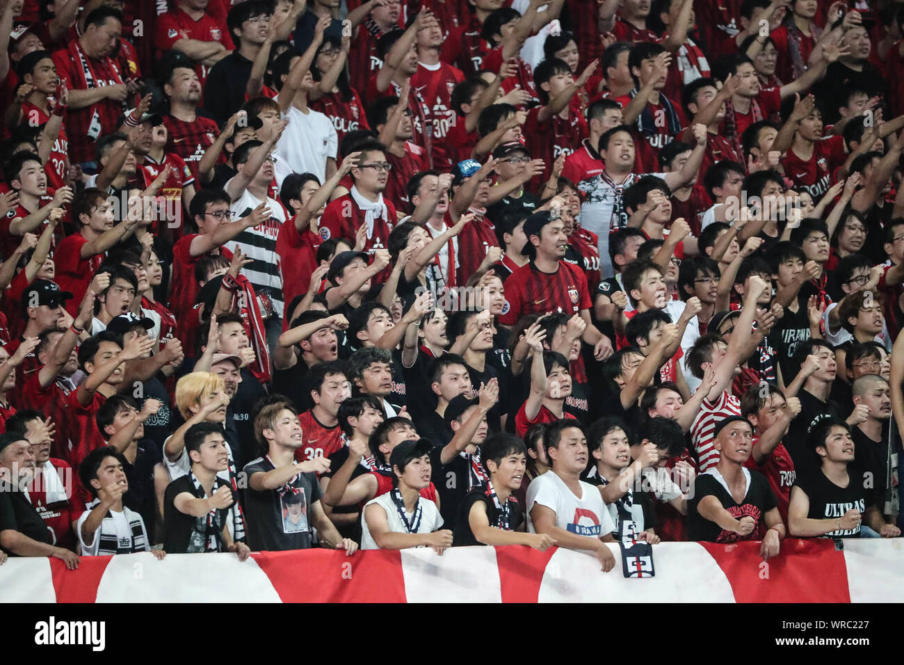 Chinese football fans cheer up to show support for Shanghai SIPG during ...