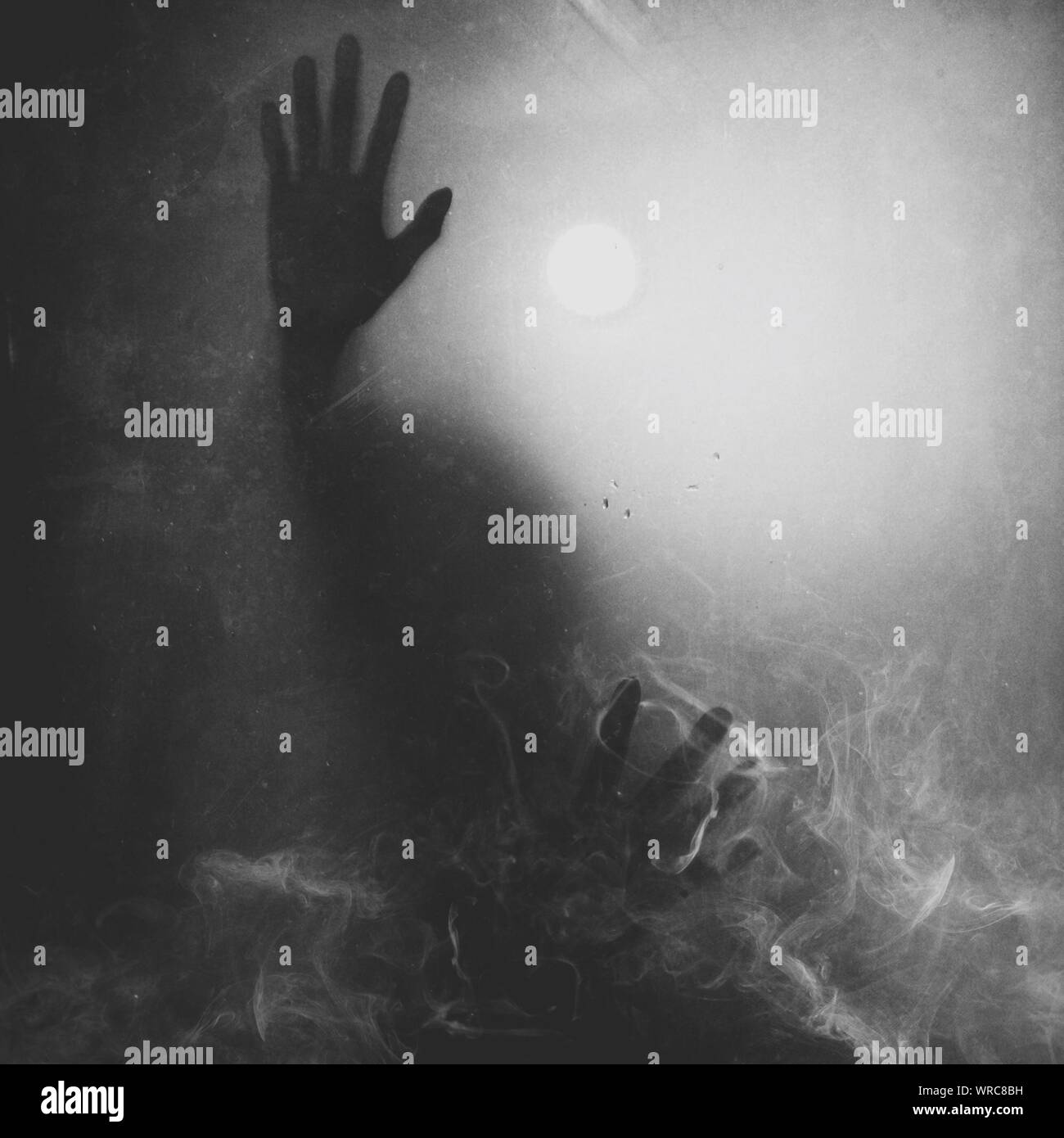 Hands behind translucent glass hi-res stock photography and images - Alamy