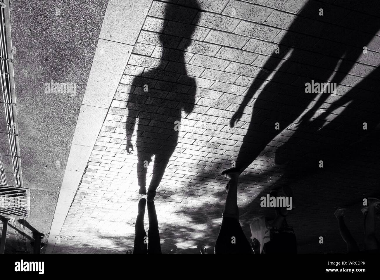 Shadow of walking people hi-res stock photography and images - Alamy