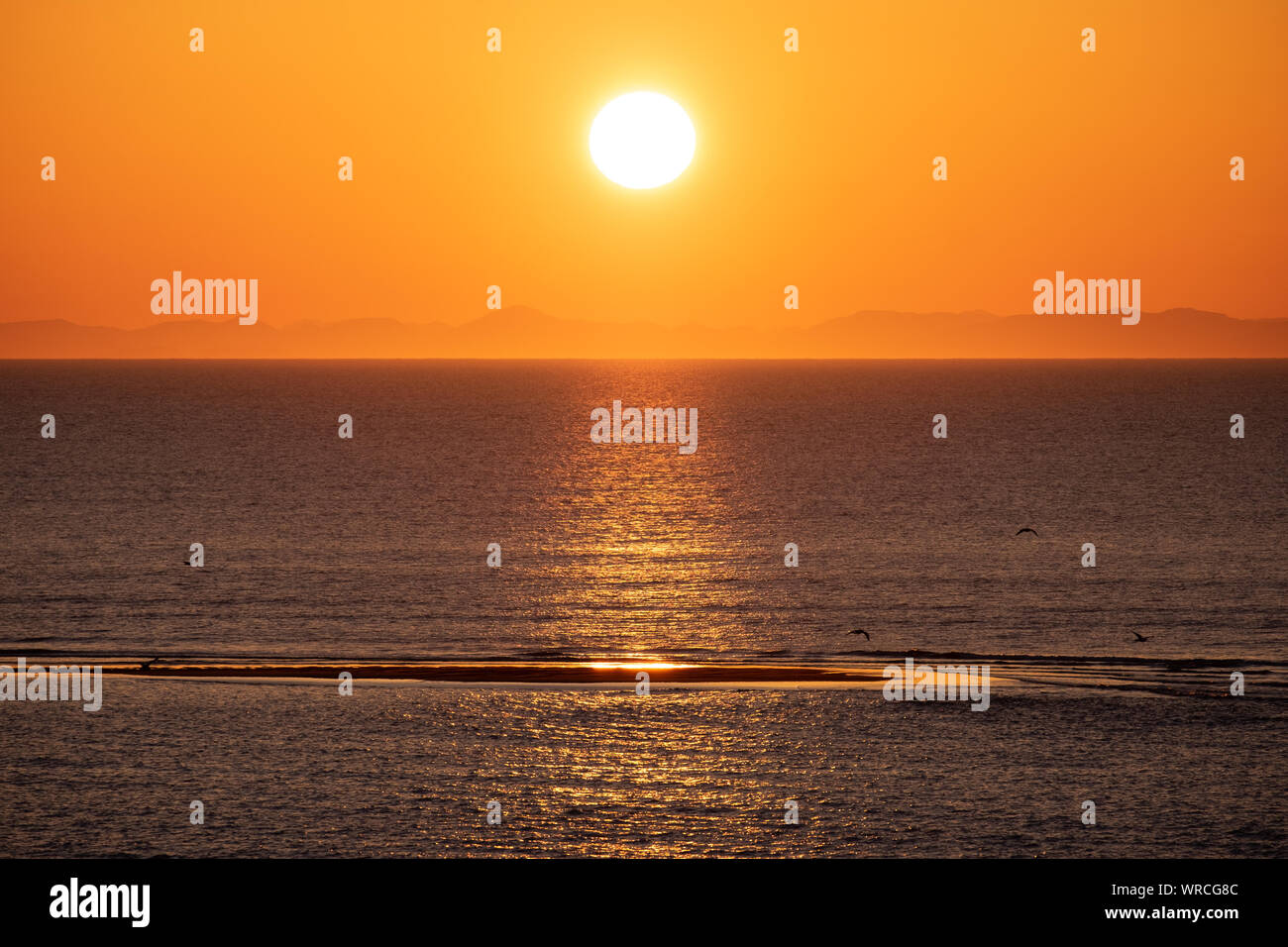 Canadian Sunset over water Stock Photo - Alamy