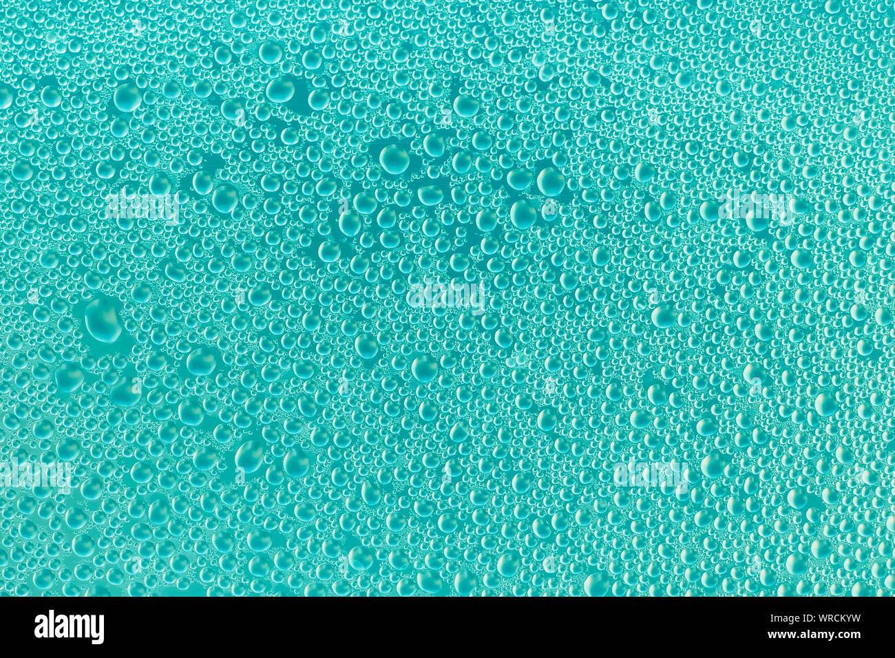 Water drops on turquoise surface. Blue and green abstract background of ...
