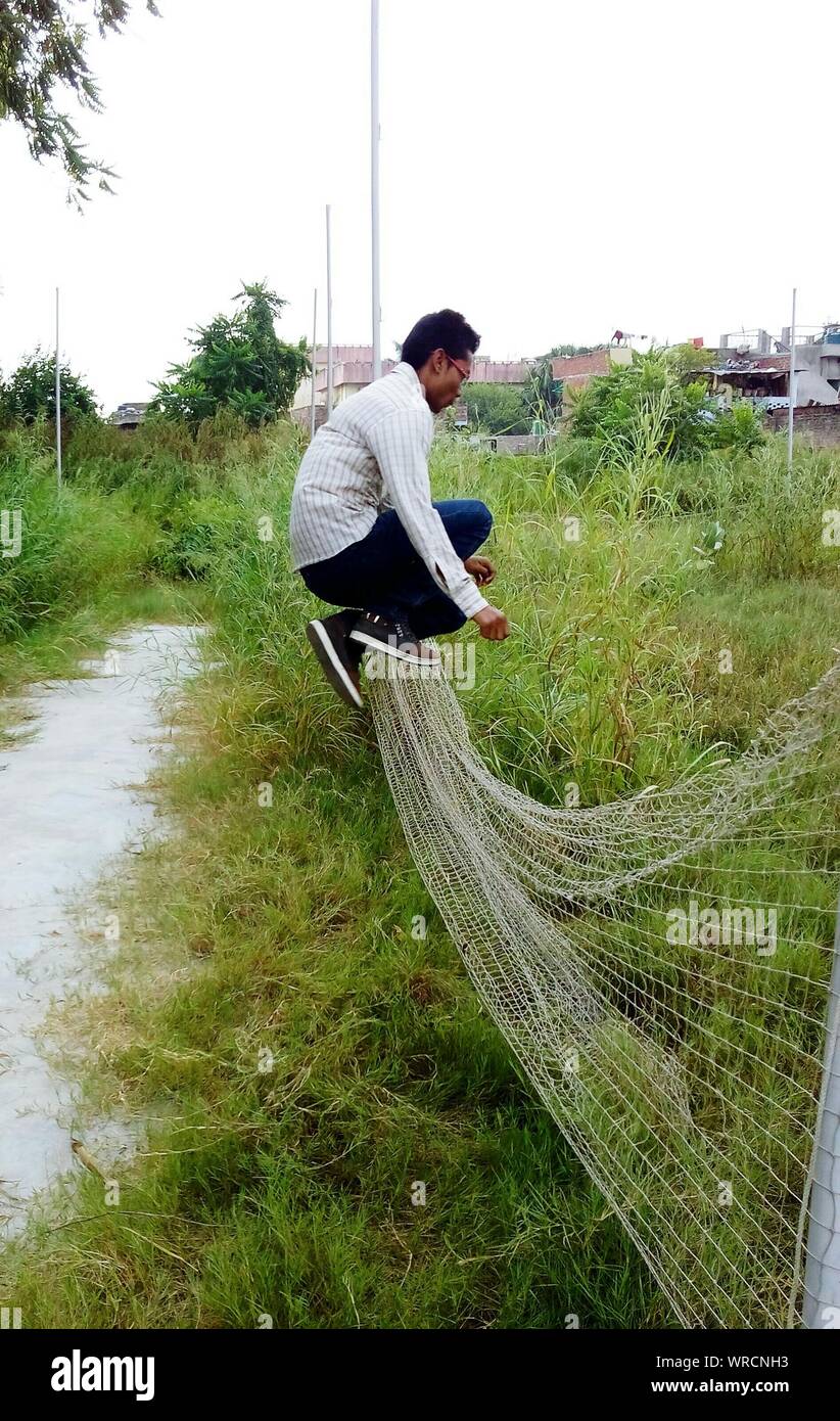 Man Jumping Over Fence High Resolution Stock Photography and Images - Alamy