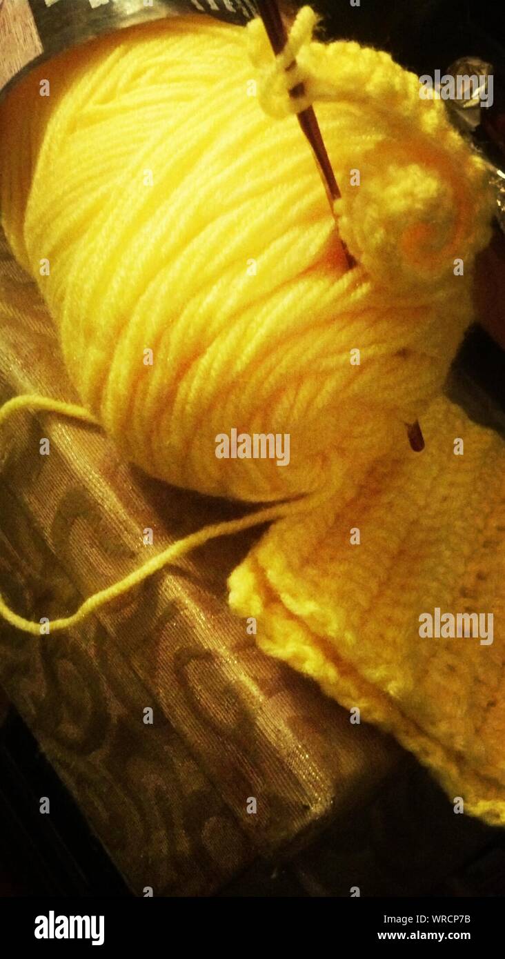 Yellow ball of yarn hi-res stock photography and images - Alamy